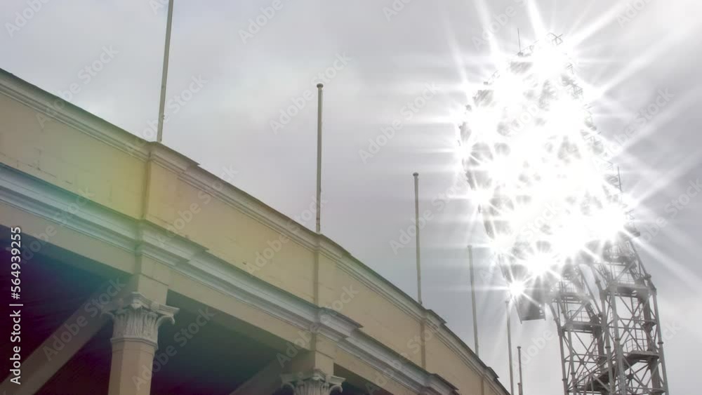 Turning on the Sstadium Lighting. Above the open stadium, a large ...