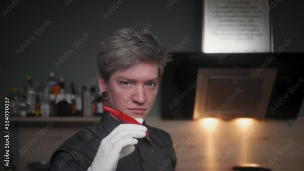 Attractive professional male chef in an elegant black shirt with an ...