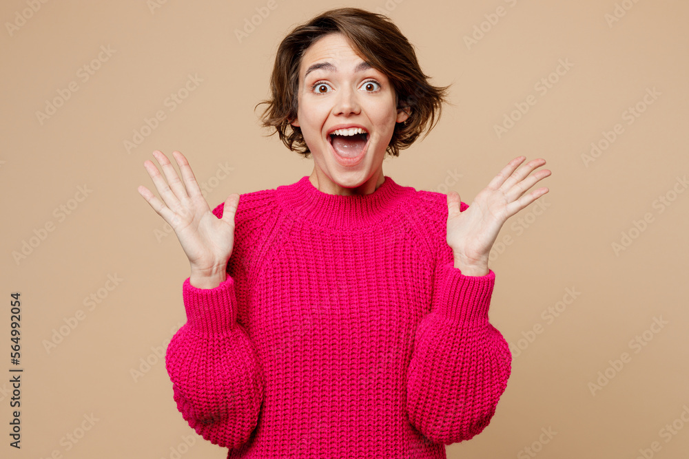Young exultant jubilant happy fun surprised shocked woman wear pink ...