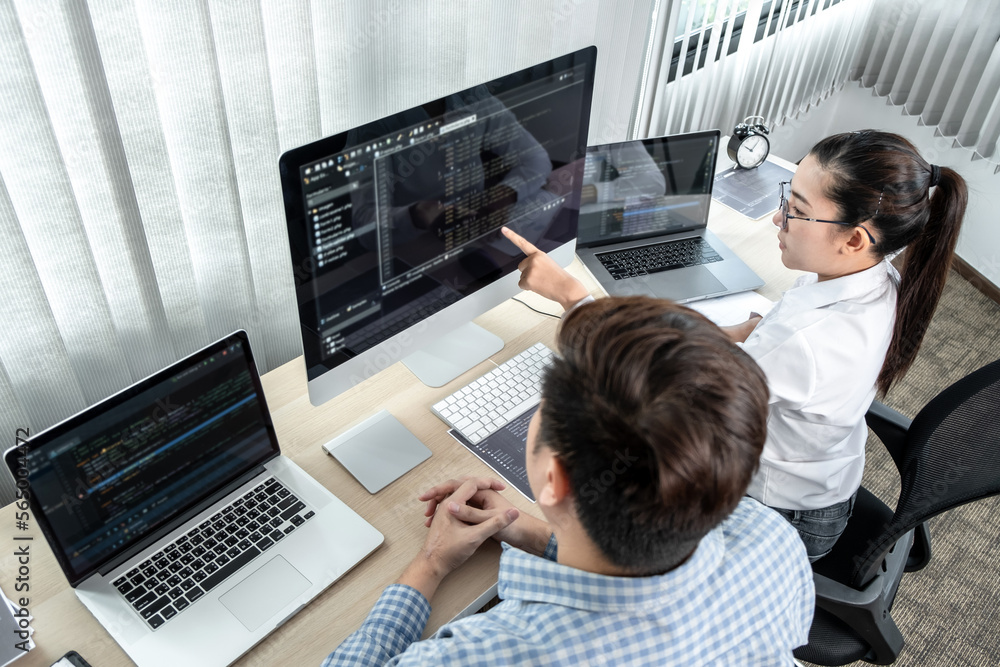 Foto de Team of two professional programmers working on website ...