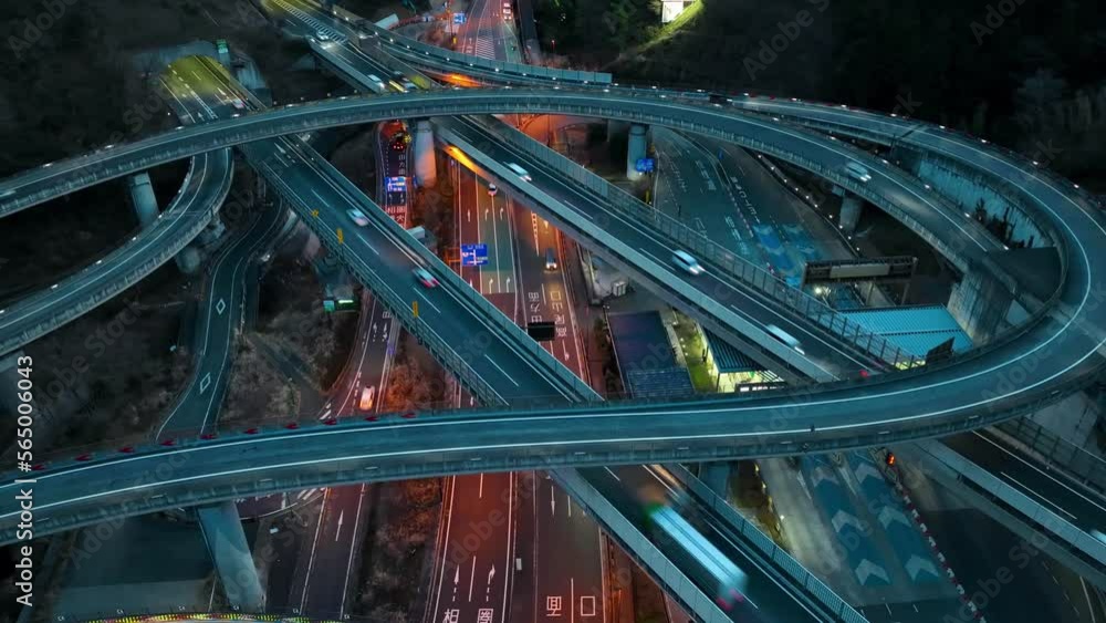 hyper lapse of busy traffic on highway intersection at night, urban ...