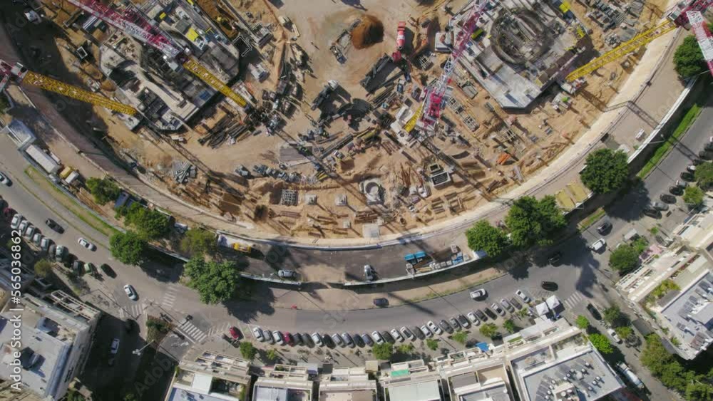 An aerial view of a tower crane on a construction site in a big city ...