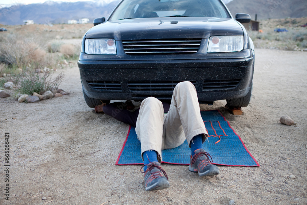 Man fixing a car. Stock Photo | Adobe Stock