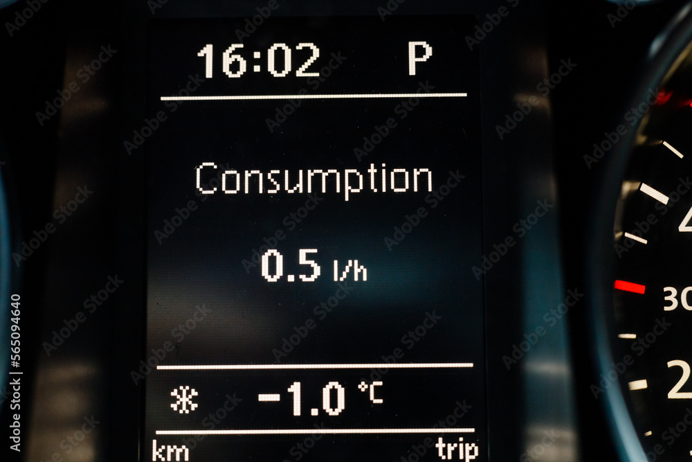 Screen on dashboard of car shows fuel consumption at idle and air ...
