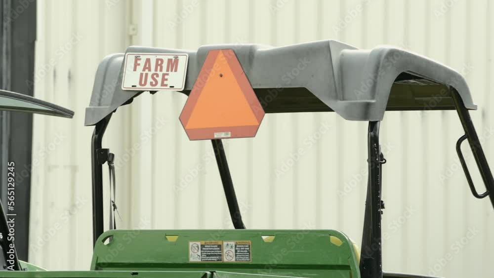 a 4x4 two seater all purpose farm use vehicle with plastic roof and ...