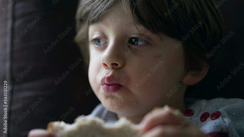 Child eating sandwich. Closeup small boy hand holding carb food snack ...