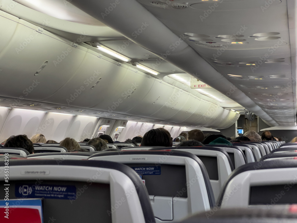 Airplane inside passenger seats Stock Photo | Adobe Stock
