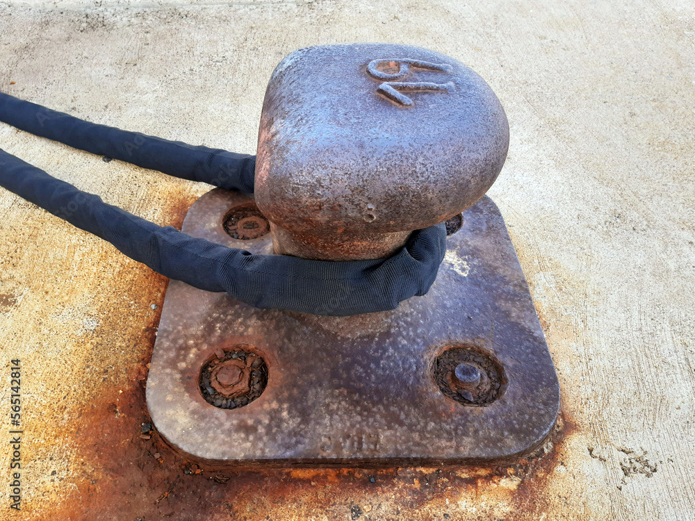 Close up of metallic and rusty bollard. Mooring bollard with heavy duty ...