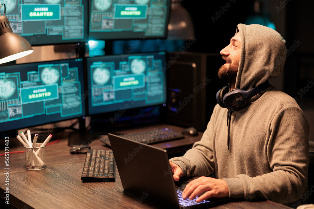 IT male hacker using computer to break system firewall, hacking security server. Dangerous thief ...