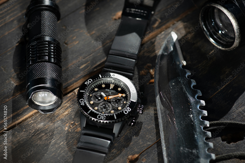 SEIKO Prospex black diver watch and knife no wooden table. Black ...