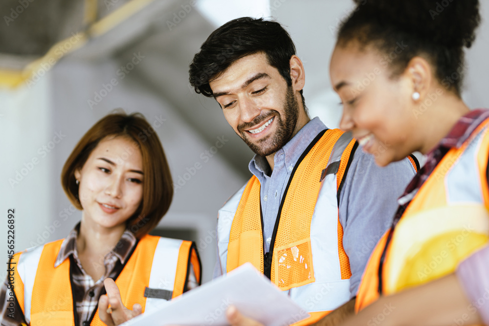 Three experts inspect commercial building construction sites ...