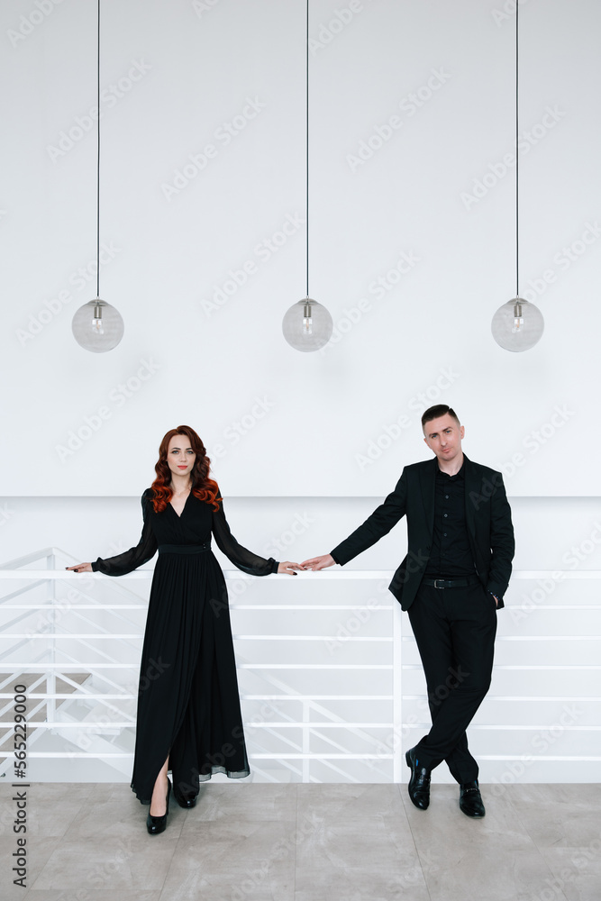 Stylish beautiful photo session in a photo studio of a luxurious couple ...