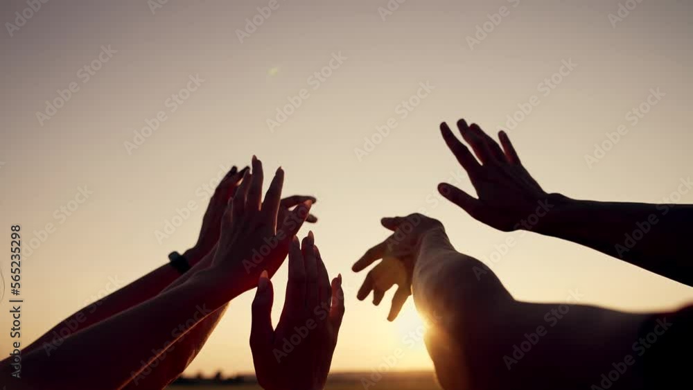 Happy family. Group of people stretch their hands to sun. Teamwork of ...
