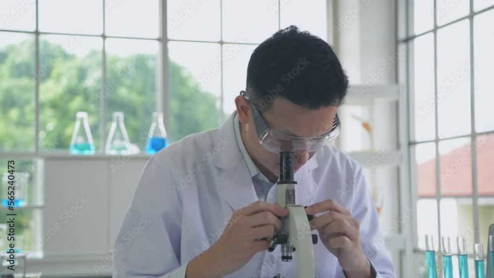 Research concept of 4k resolution. Asian scientists are examining the ...