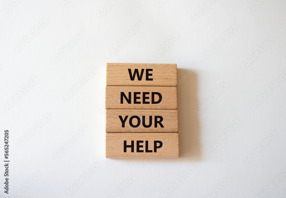 We need your help symbol. Wooden blocks with words We need your help ...