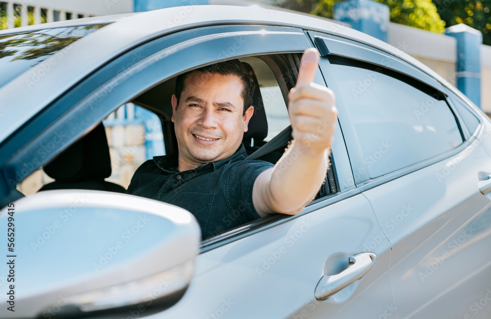Man in his car giving thumbs up, Happy Driver giving a thumbs up ...