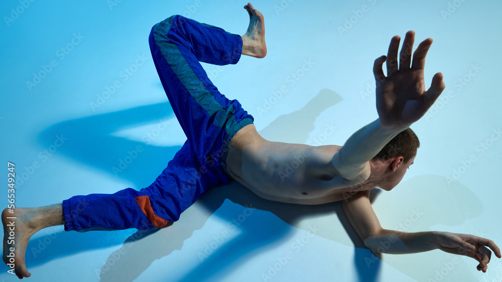 Contemporary dance style. Young shirtless man dancing experimental ...