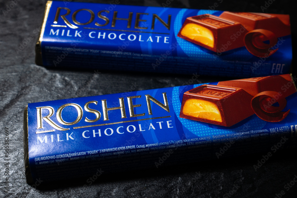 LVIV, UKRAINE - January 25, 2023 : Roshen Milk chocolate bar on black ...