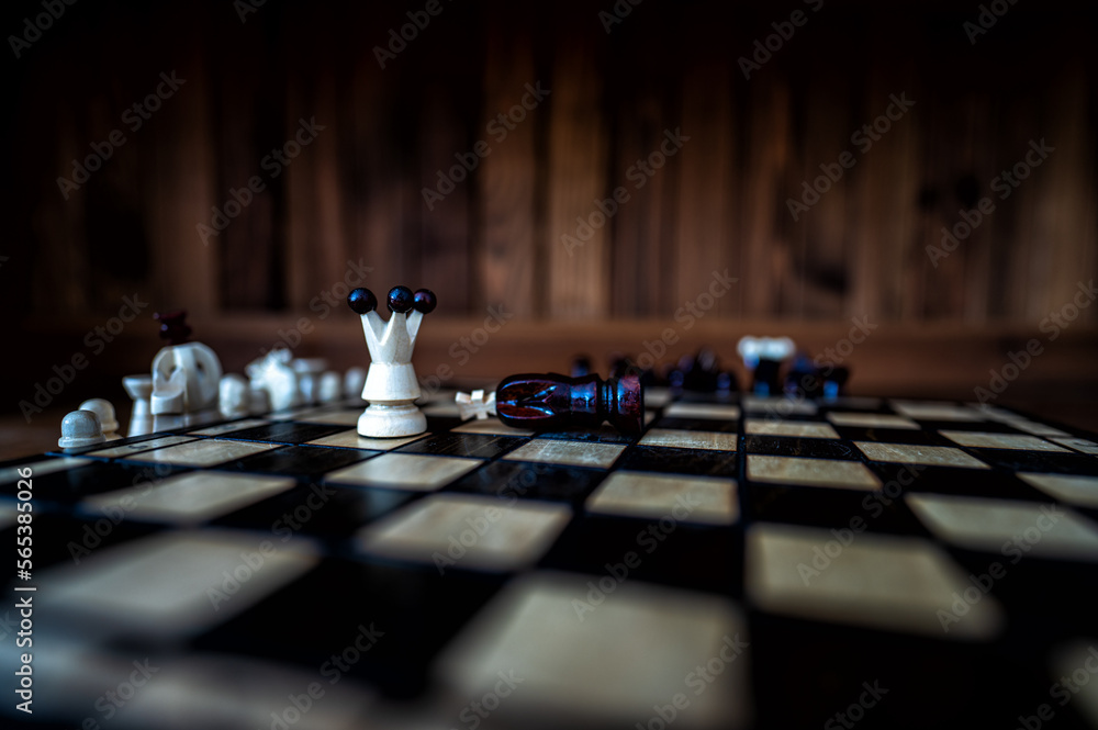 Blurred background with a low depth of focus. The set of wooden chess ...