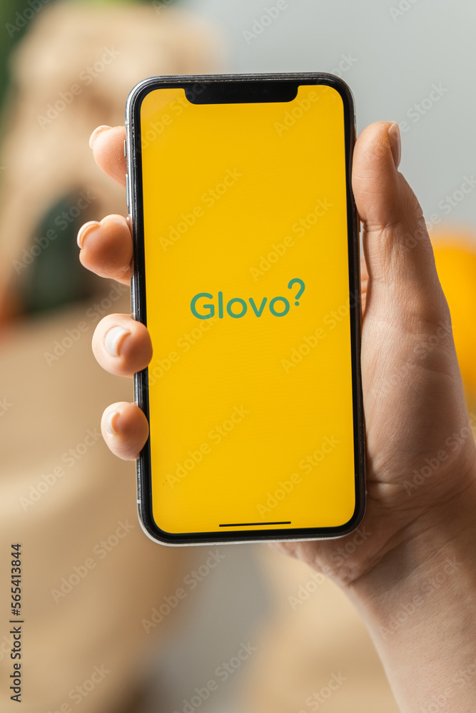 KYIV, UKRAINE - January 17: Female hand holds mobile phone with Glovo ...