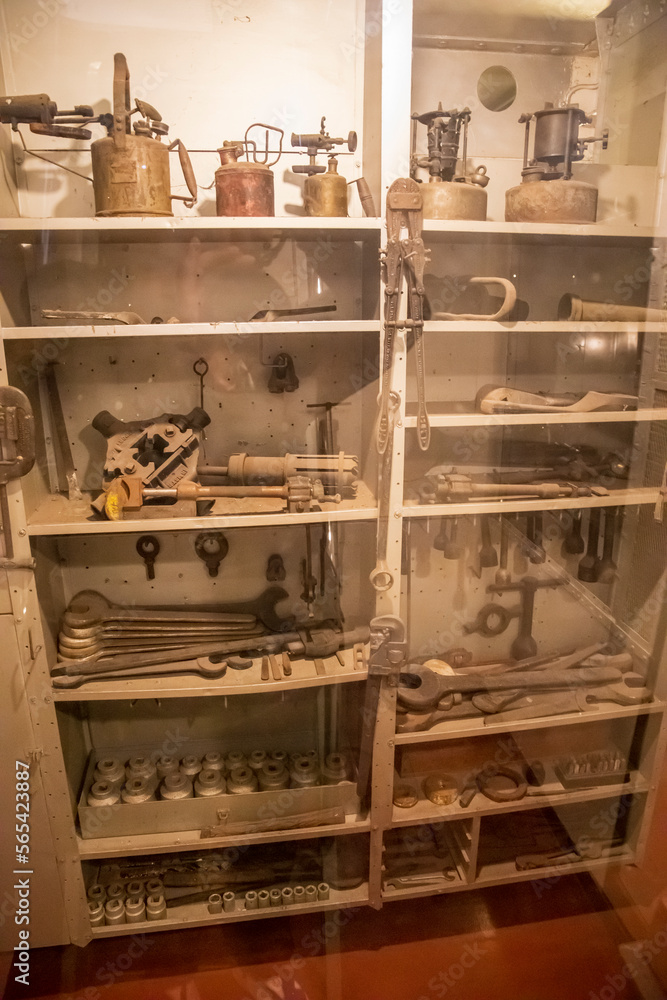 Inside The First Deck Of The Uss Alabama Battleship With Display Cases Filled With Old Tools
