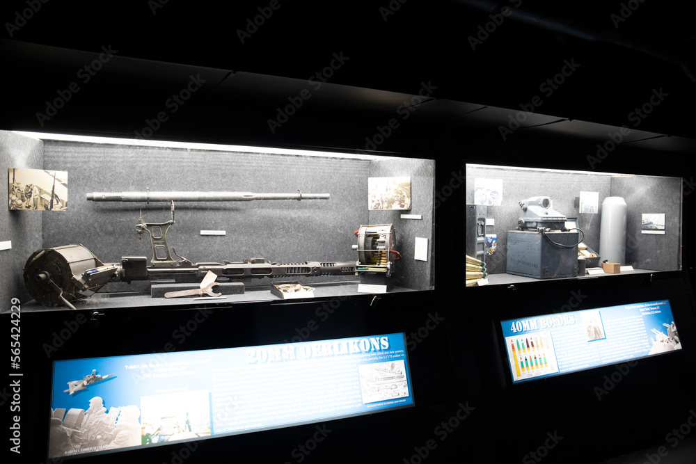 Inside the first deck of the USS Alabama Battleship with display cases ...