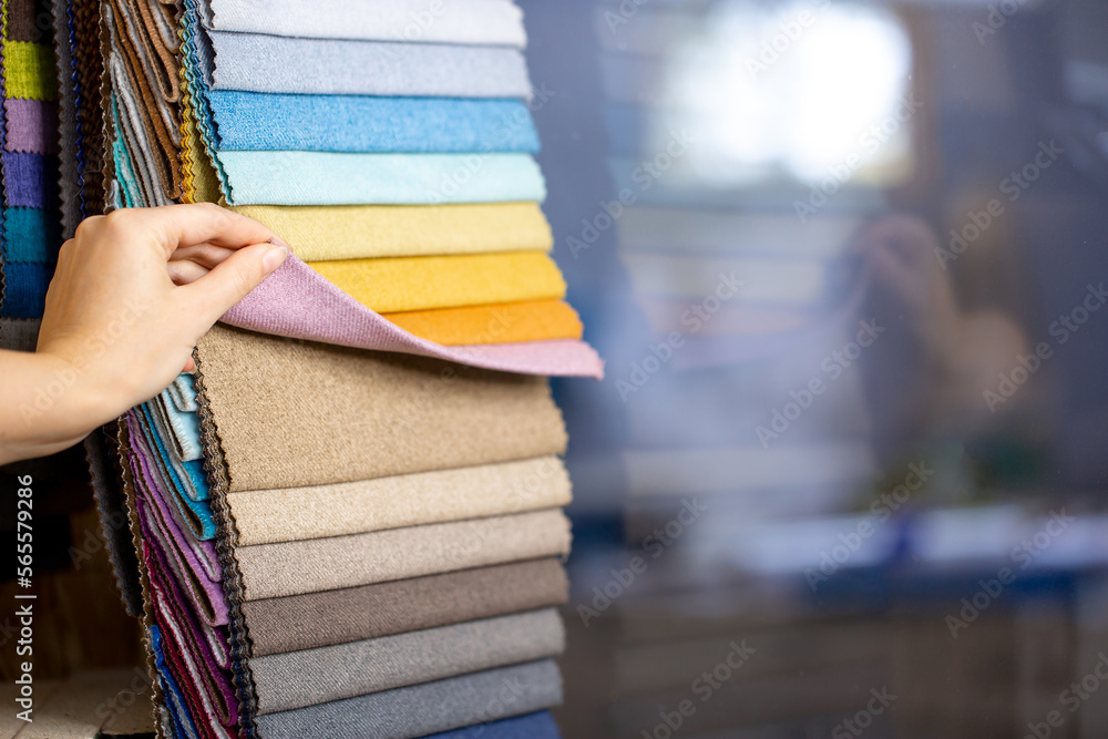 Fabric swatches in different colors are stacked for selection. The ...