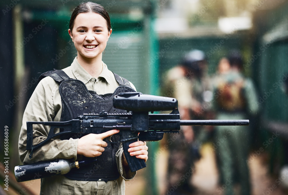 Paintball, happy and portrait of woman with gun in safety uniform for ...