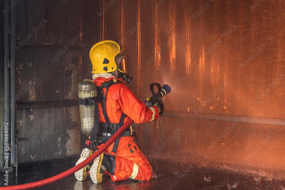 Firemen use extinguisher water fight fire burn during firefight ...