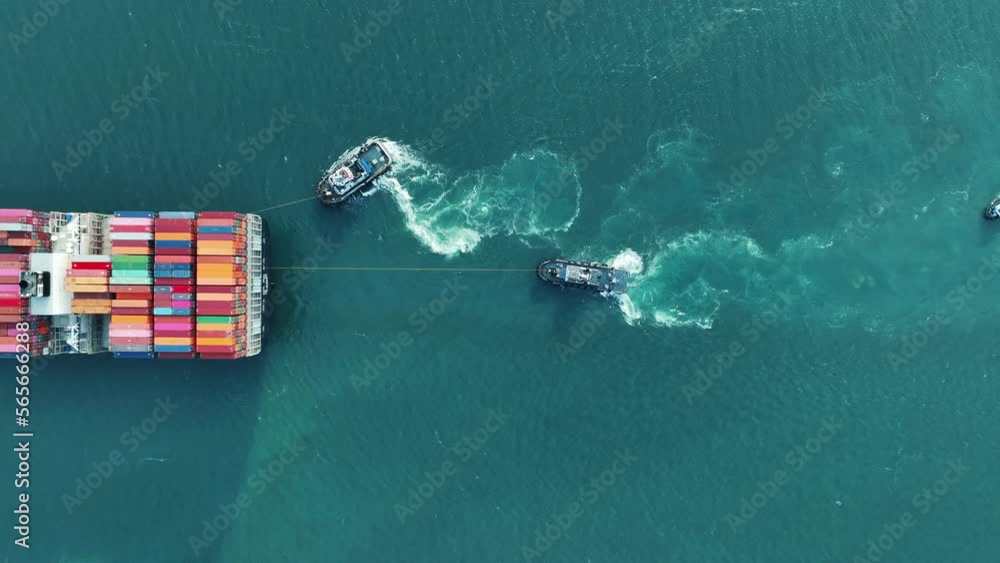 Tugboat drag Largo Cargo Container Ship. Stern of Container Ship with ...