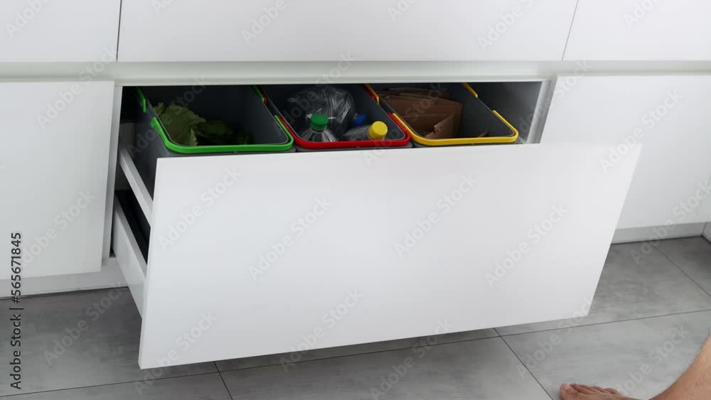 Colorful bins for sorting of plastic, paper garbage and organic waste ...