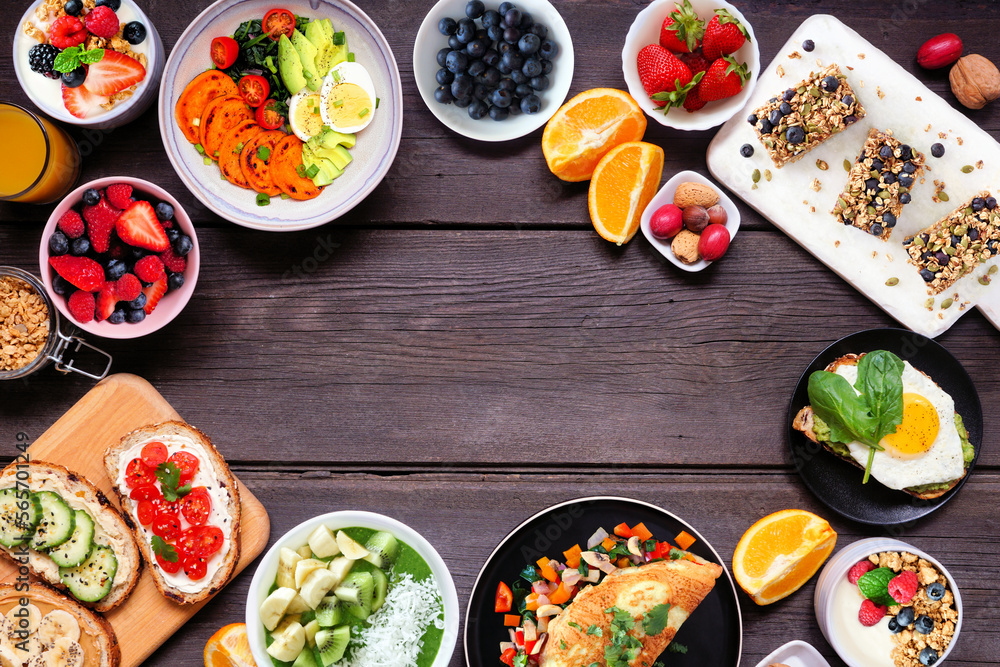 Healthy breakfast food frame. Top view over a dark wood banner ...