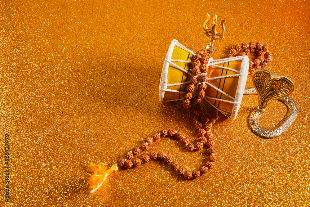 Shivaratri background with Shivas trident and Pellet Drum Damroo ...