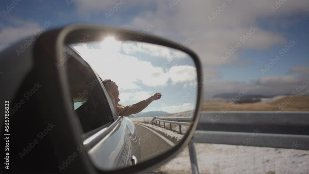 free girl hand out of the window rides a car wind in the face. concept ...
