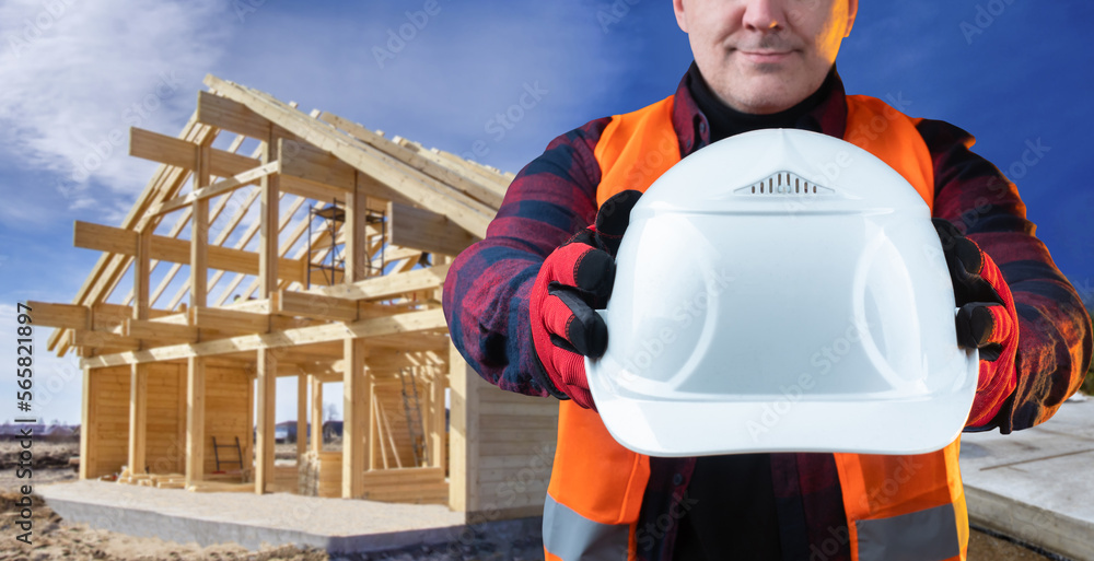 Foto de Protective helmet in hands of builder. Man shows white ...