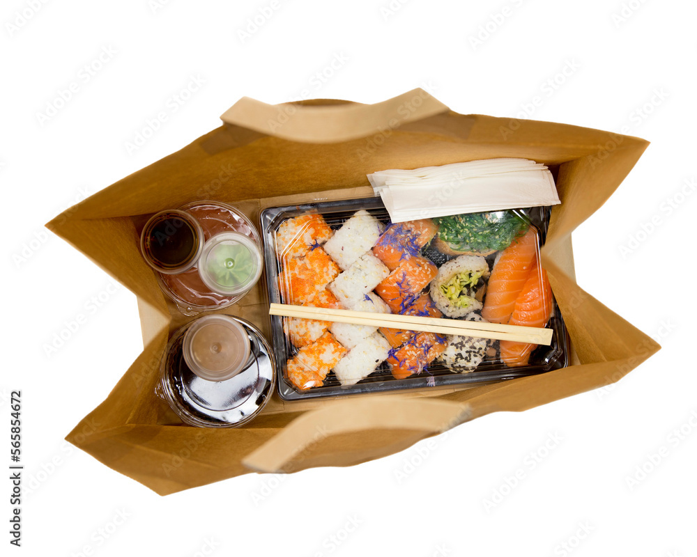 Sushi to go concept. Top view of takeaway box with sushi rolls and ...