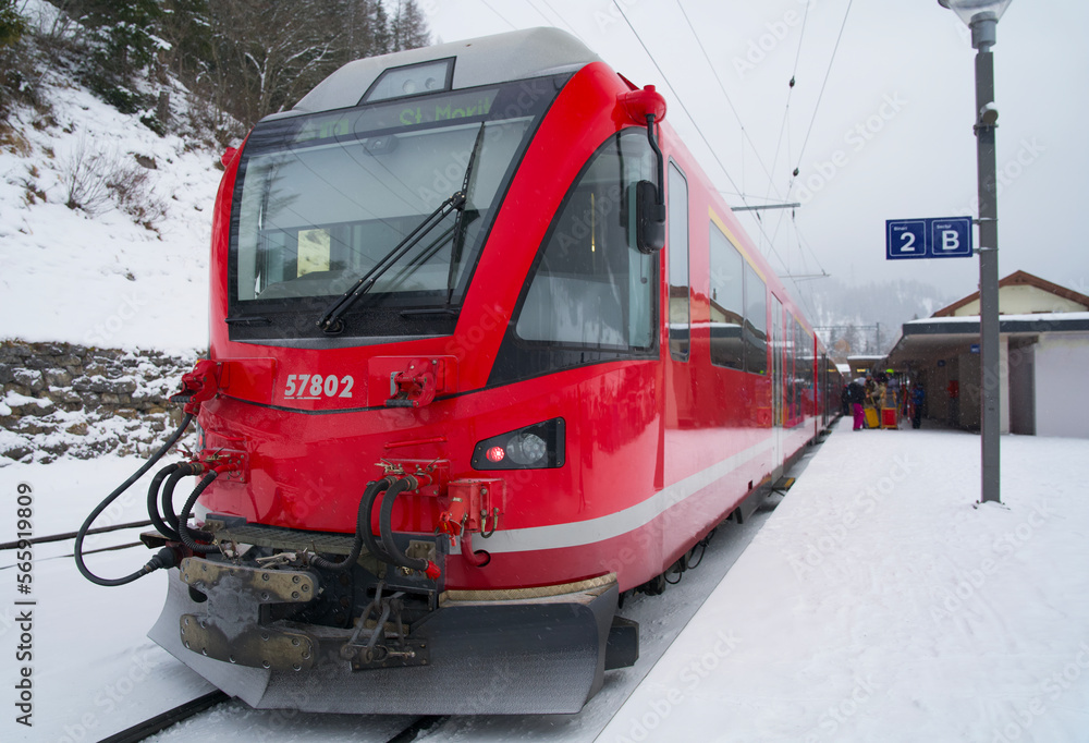 Red swiss train of the albula express railway in winter Stock Photo ...