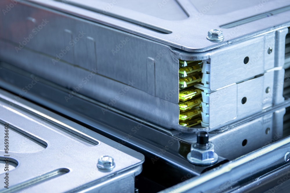a close-up photo of an assembled EV battery module. Through the ...