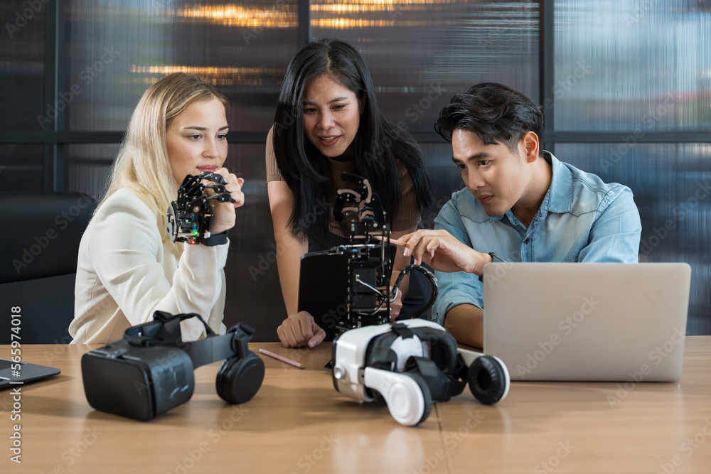 Male and female engineer working with AI robot arm system project in ...