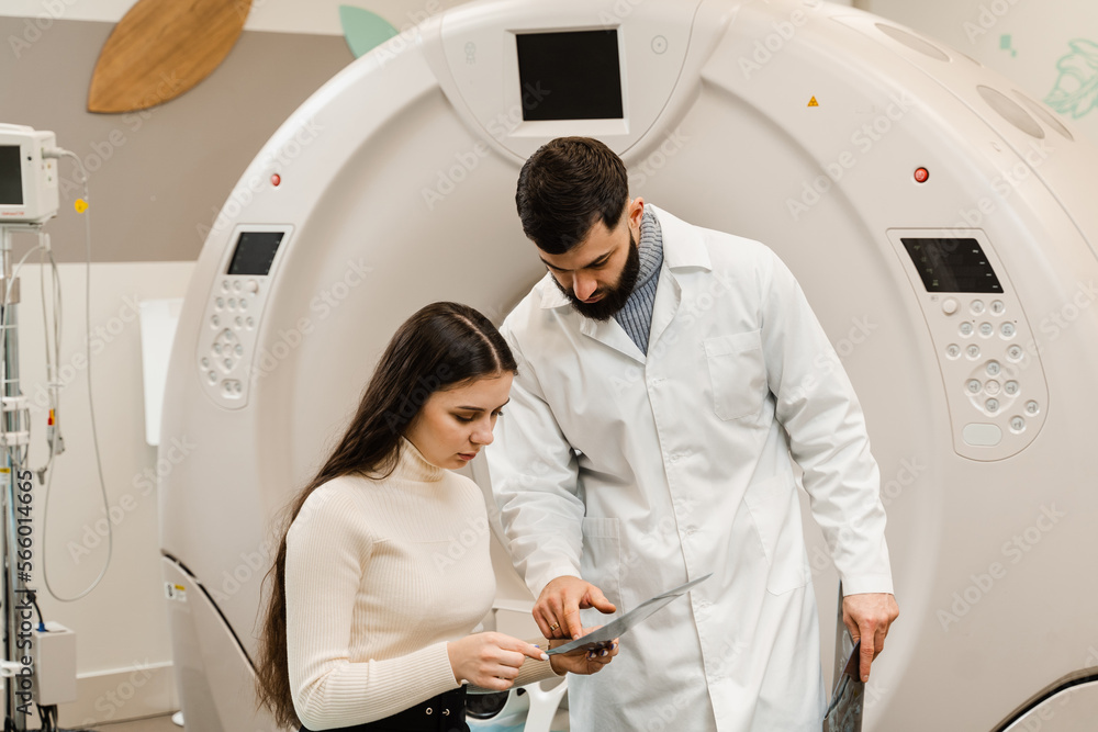 CT Doctor consulting patient and showing brains x-ray to patient in ...