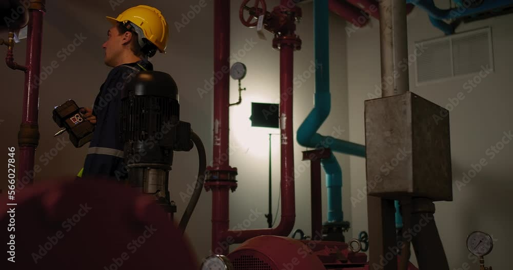 Professional engineer worker man in safety uniform holding flashlight ...