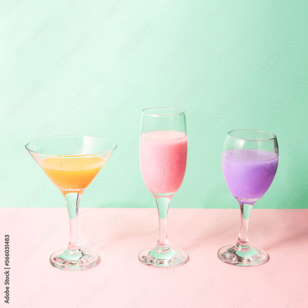 Colorful cocktails on pastel light pink and green background. Creative ...