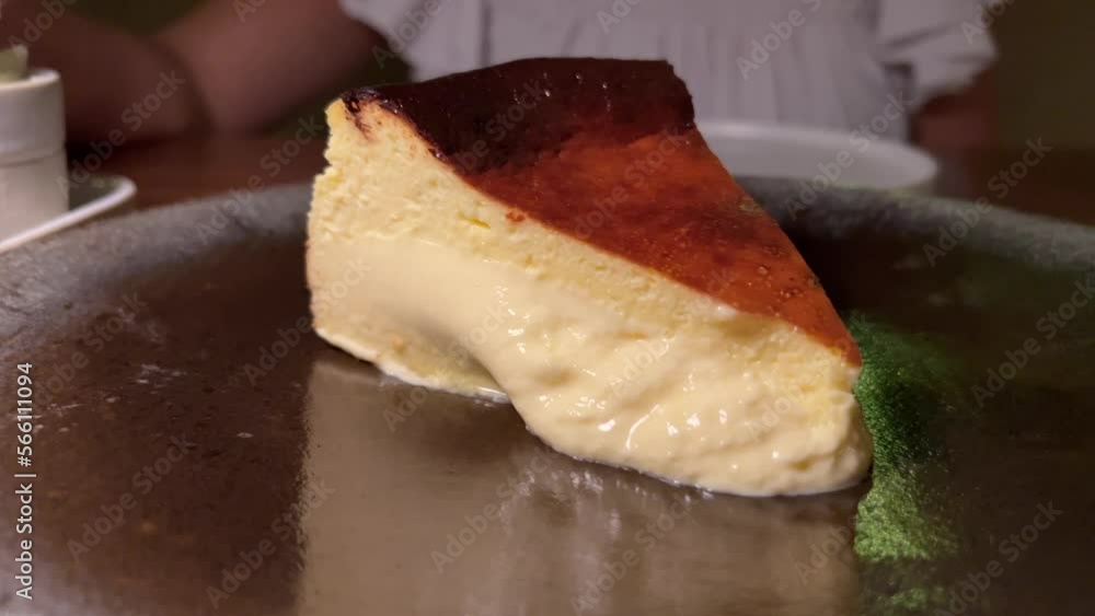 Traditional Spanish burnt basque cheesecake, sweet creamy dessert on a ...