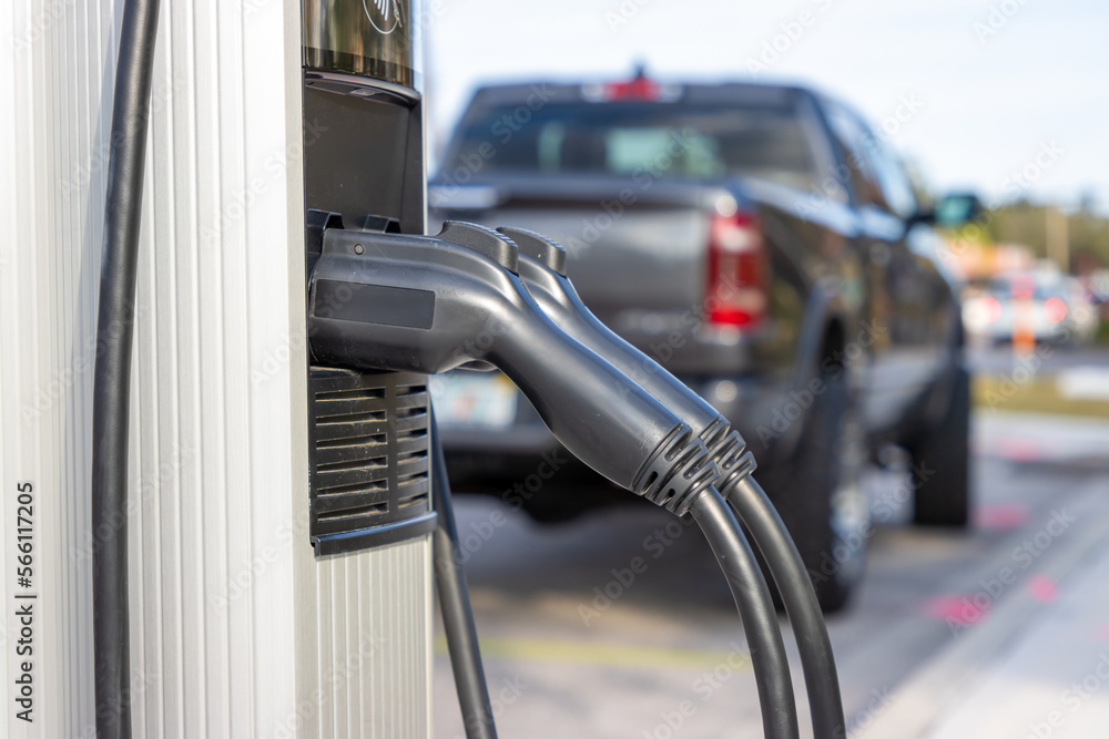 EV plugs in front of truck Stock Photo | Adobe Stock