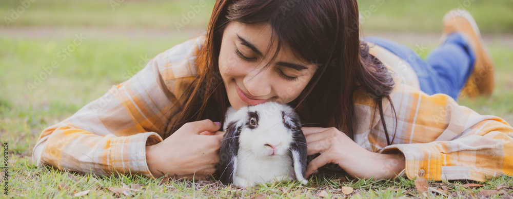 Foto de relationships of cheerful rabbit and happy young human girl ...