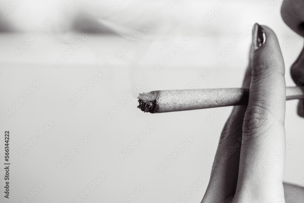 Black and white photos of a girl holding a lit joint Stock Photo ...