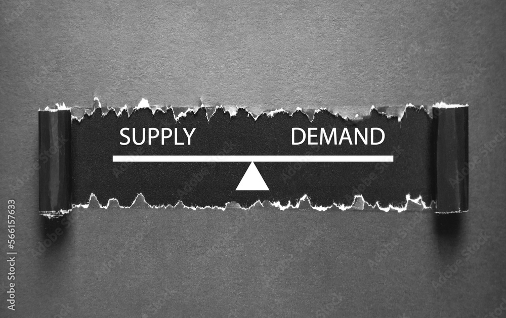 Supply and Demand balance scales on torn paper. Stock Photo | Adobe Stock