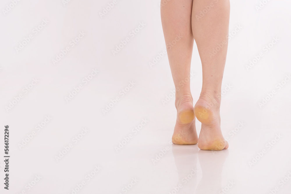 beautiful women's feet on white background. Pure white skin of the feet ...