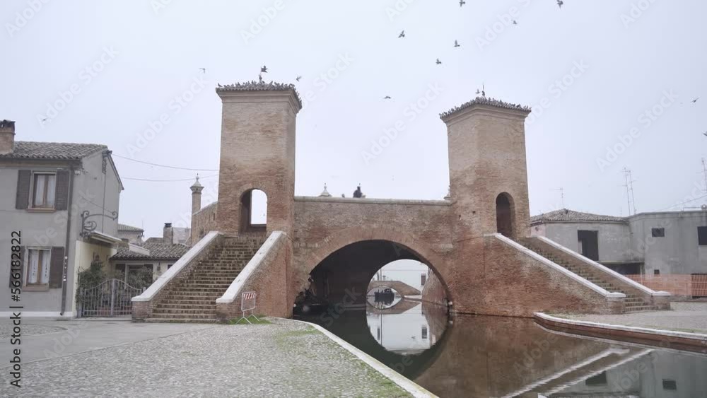 Ancient Italian construction, placed on a water channel, with two ...