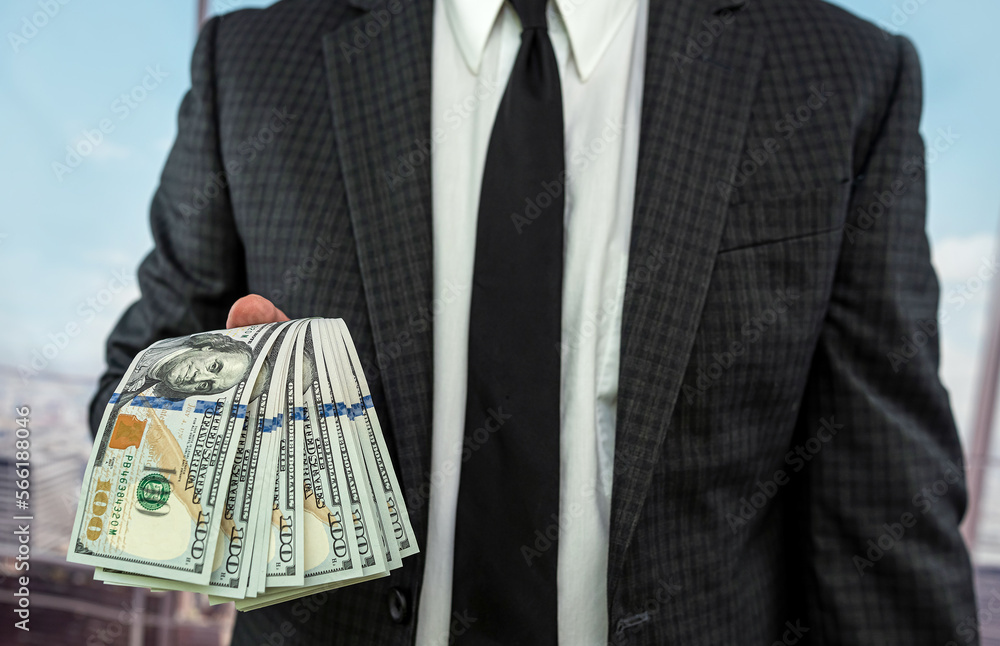Business man in siut showing one hundred 100 us dollar bills Stock ...